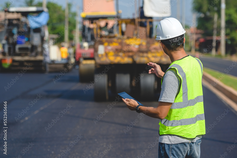 Asian Civil Engineering works at road construction sites to supervise ...