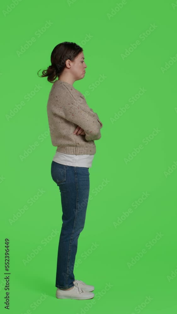 Vertical video: Profile of sad woman acting discouraged over isolated ...