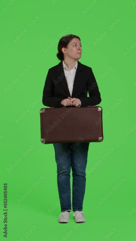 Vertical video: Front view of office employee carrying vintage suitcase ...