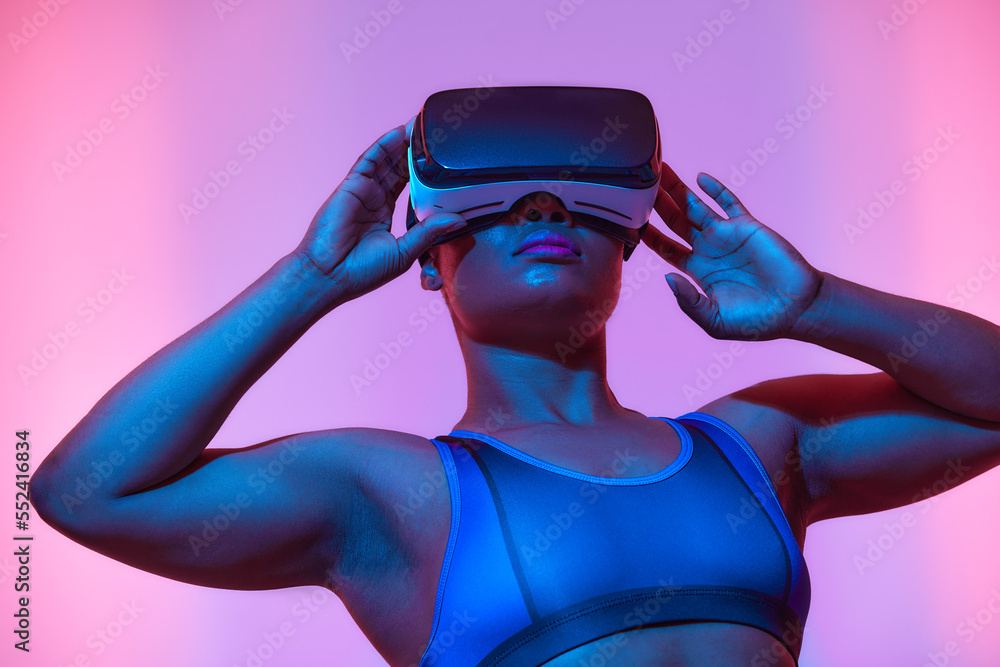 African american woman streamer playing video game using virtual ...