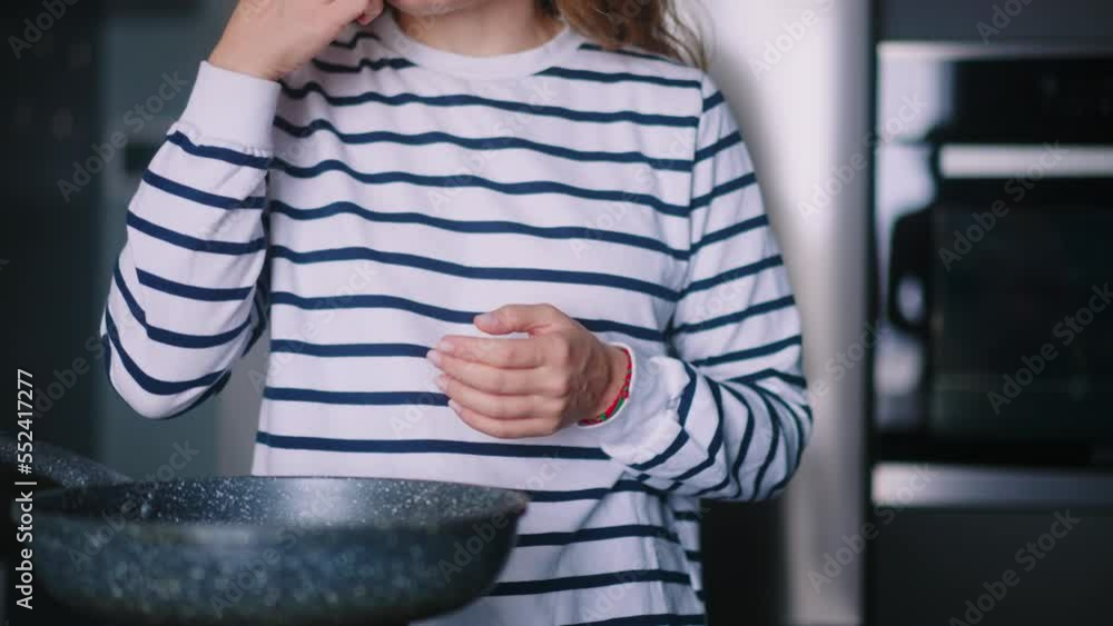 Woman eats unhealthy fried food from a pan, suffers from severe stomach ...