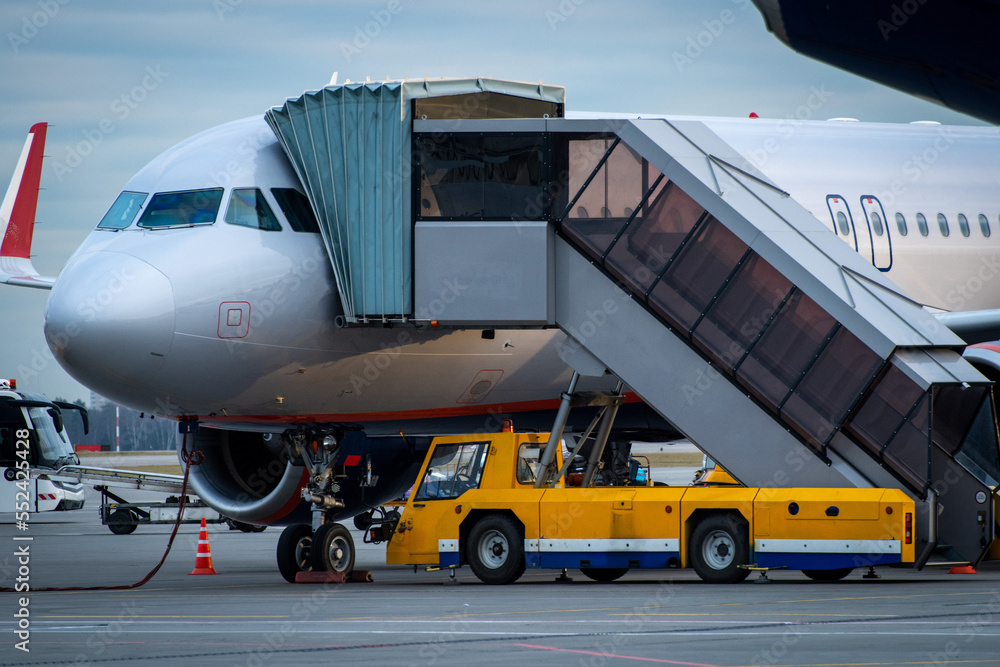 Passenger ramp at a modern passenger plane at an international airport ...