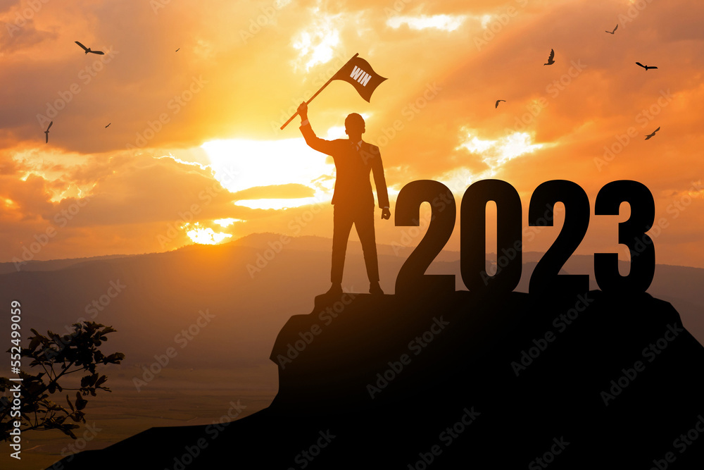 2023 New year Success concept.silhouette of businessman holding winner ...