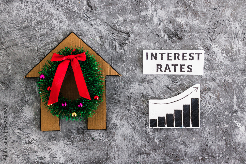 Interest Rates text and graph with stats going up next to cardboard ...