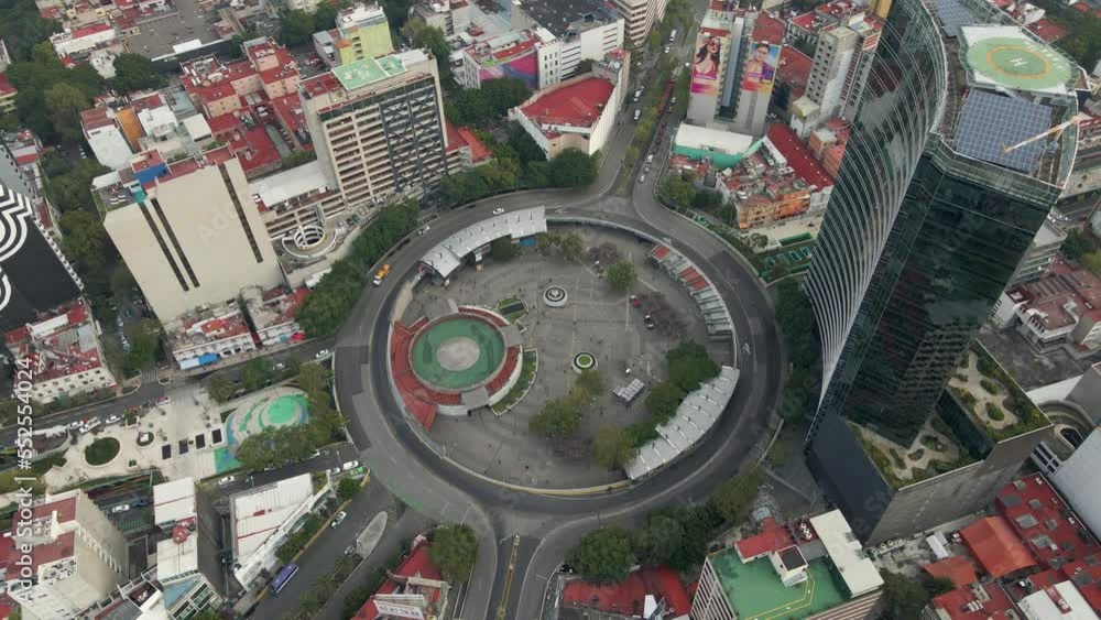 Drone flying in circles over roundabout in city of Mexico with cars and ...
