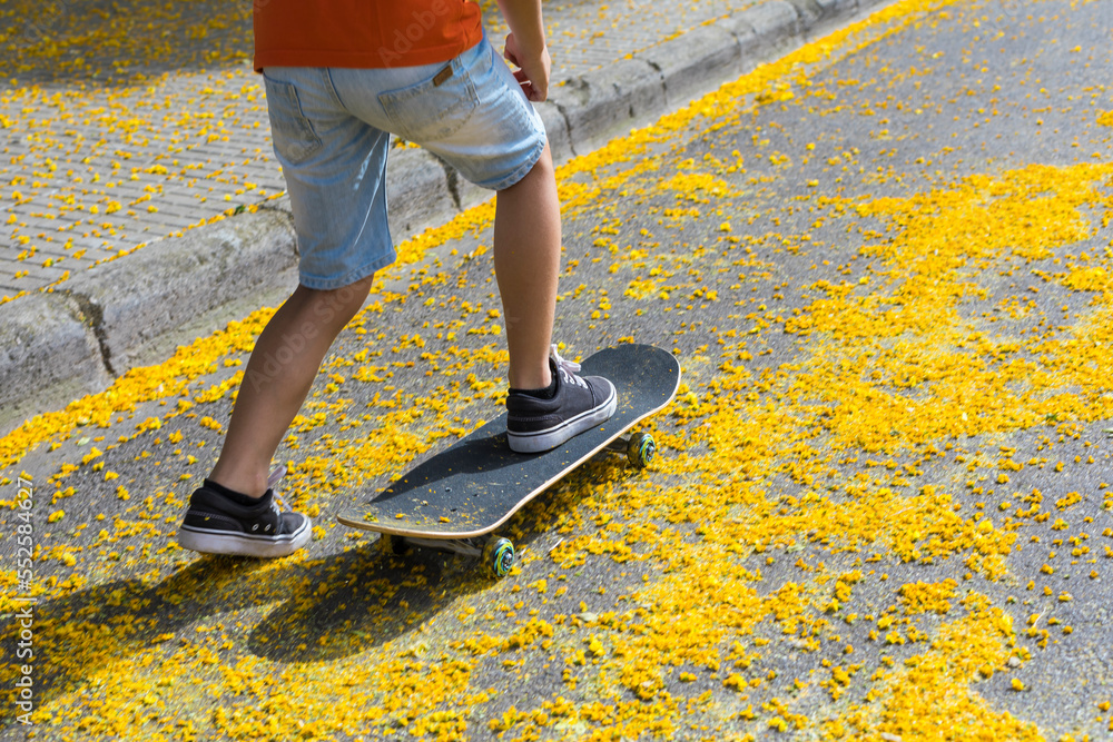 Pollen allergy. Child skating down a street full of pollen. Concept of ...