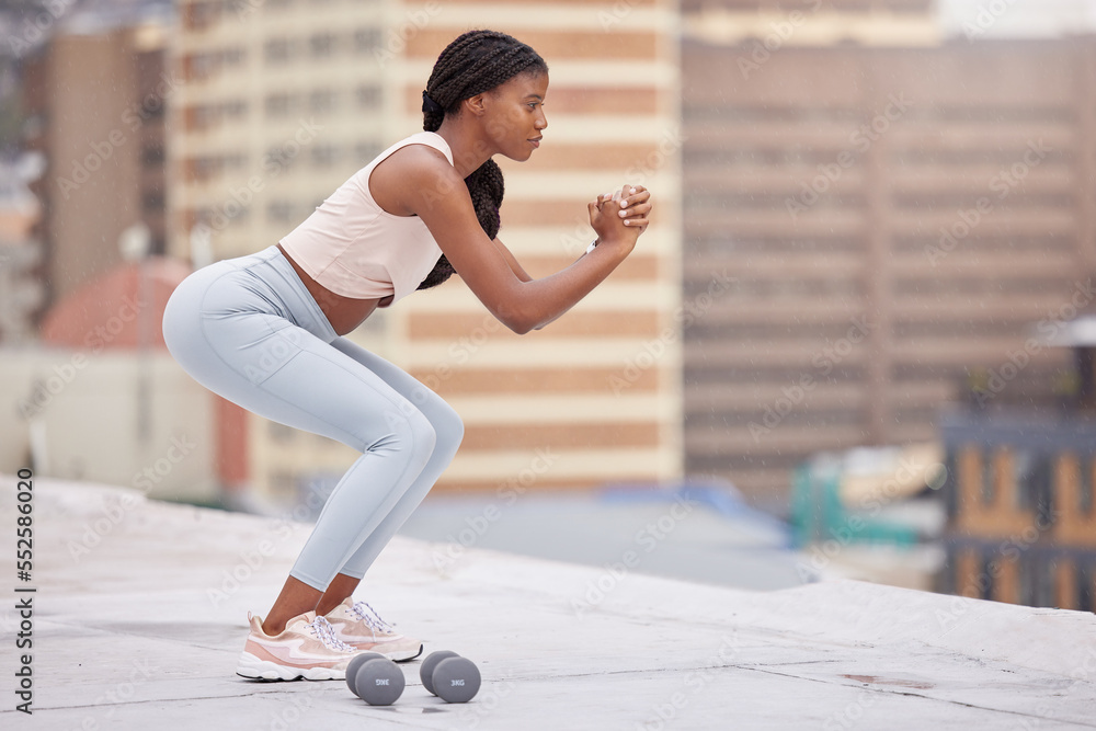 Black woman, fitness and squat training on rooftop for exercise ...