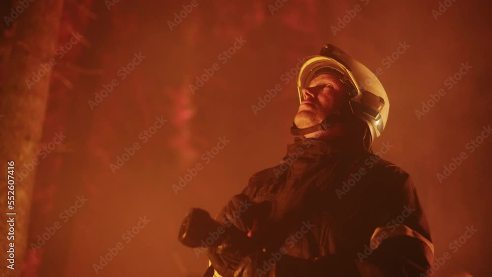 Experienced Firefighter Extinguishing a Wildland Fire Deep in the Woods ...