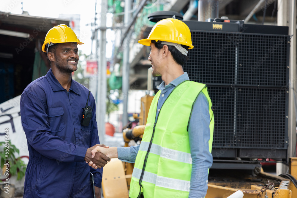 Structural engineers and construction workers are holding blueprints ...