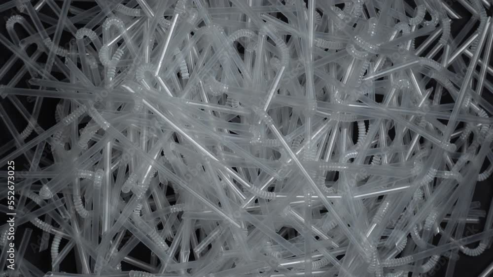 Straws made of plastic for drinking. Disposable plastic spinning on the ...