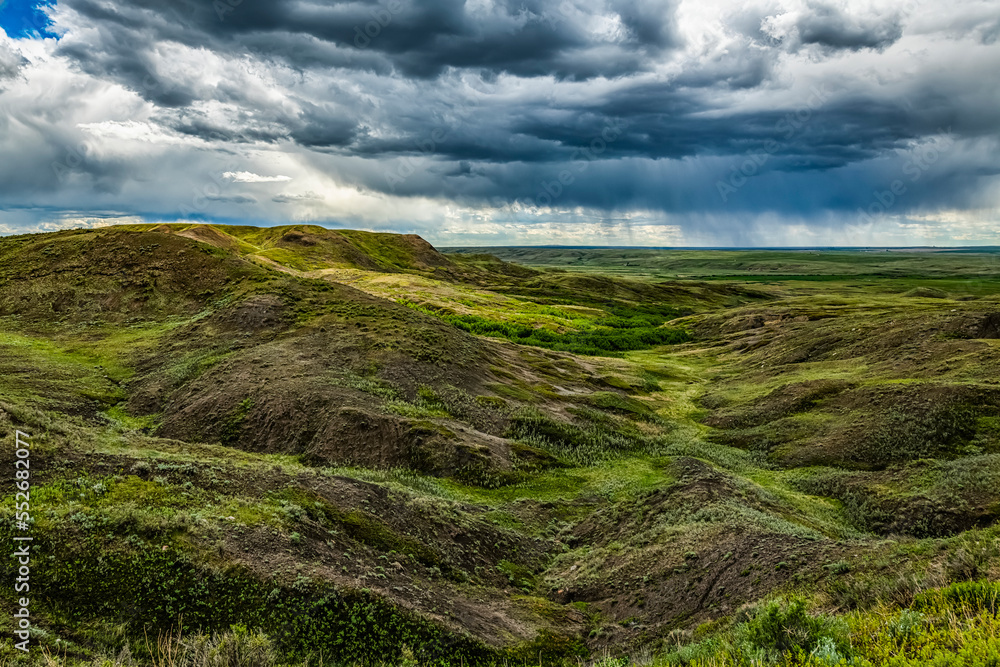 Dramatic storm clouds during a rainfall on the prairies, Grassland ...