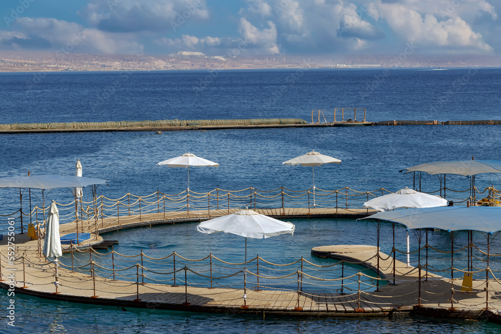 Border of the bathing place on the Red sea beach in the Israel. Round ...