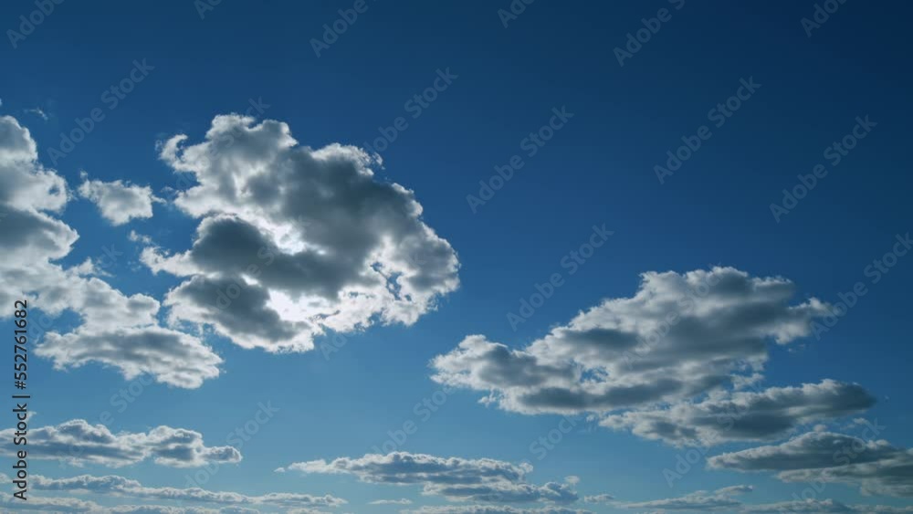 Sunrays sunray shine through dark clouds in cloudy blue sky. Layers of ...