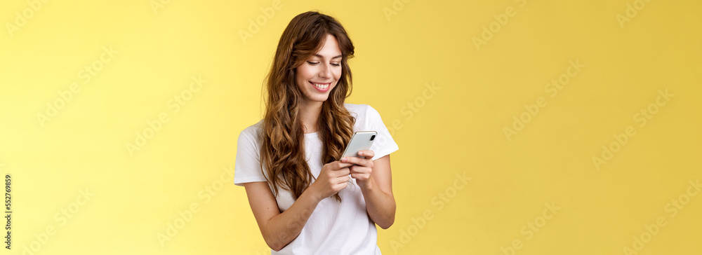 Cheerful lovely girlfriend texting friend pleased cute smile tap ...