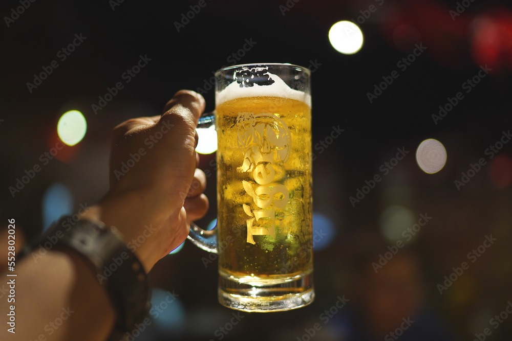 PENANG, MALAYSIA - Feb 02,2019: Hand holding a ping of Tiger beer with ...