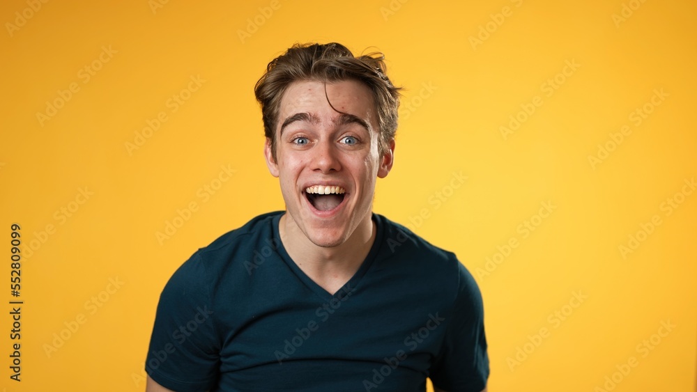 Portrait of amazed young man 20s shocked, saying WOW. Handsome guy ...