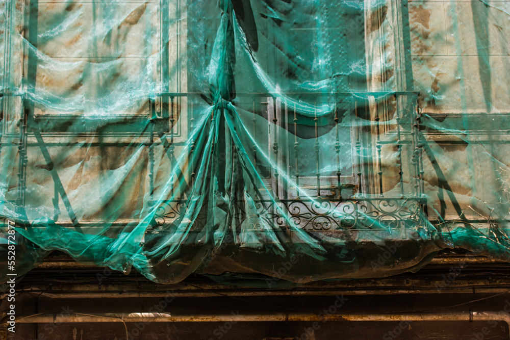 Protective net. Reconstruction of facade of historic classical ...