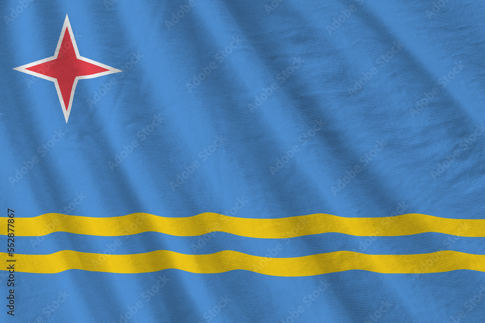 Aruba flag with big folds waving close up under the studio light ...