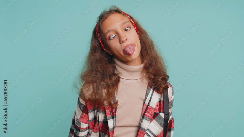 Happy young preteen school girl making playful funny silly facial ...