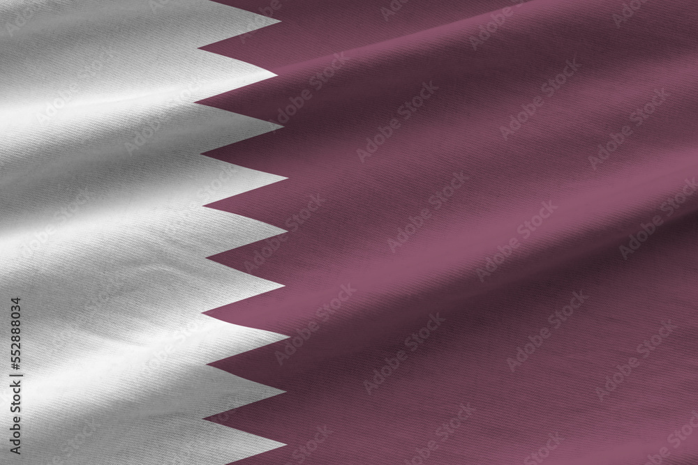 Qatar flag with big folds waving close up under the studio light ...