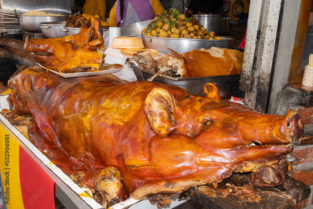 Whole roasted pig (chancho, hornado) in traditional cuisine restaurant ...
