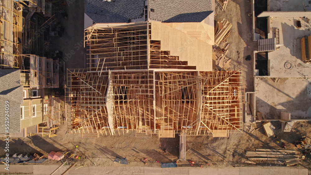 Roofing construction aerial. Wooden roof frame installation of the ...