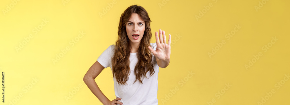 Stop right there fashion police. Serious-looking confident young curly ...