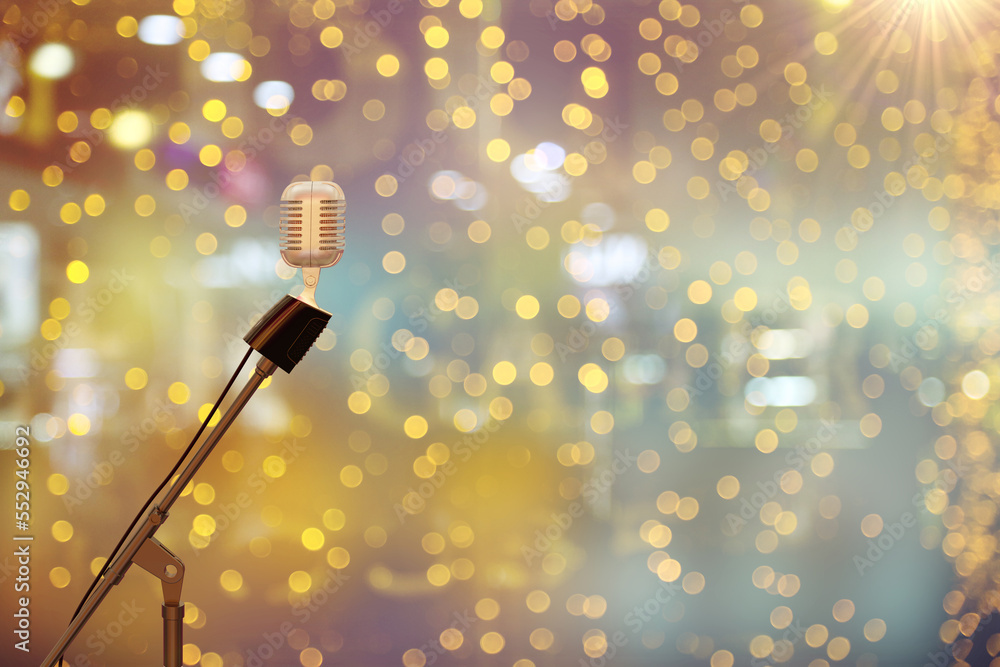 Microphone in concert hall with blurred lights at background. Retro ...