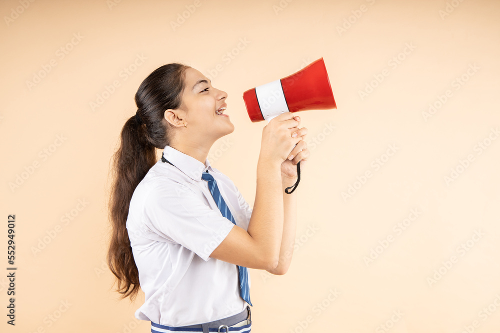 Happy Excited Indian student schoolgirl wearing school uniform hold ...