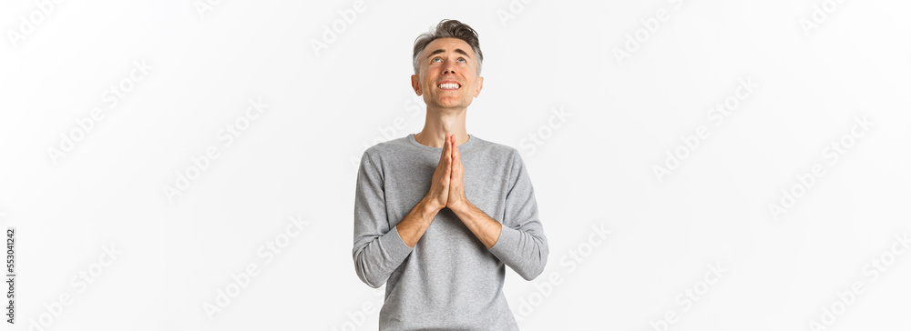 Image of nervous middle-aged man begging God, looking up and pleading ...