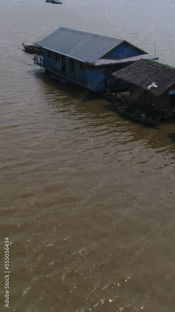 Vertical video of Drone footage of the floating houses where the Kam ...