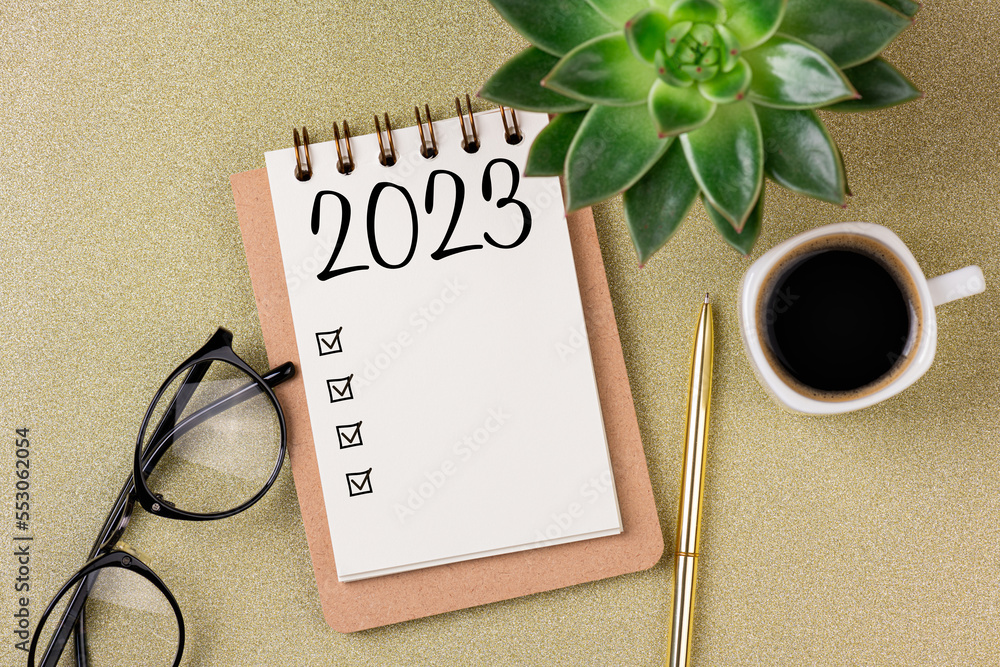 New year resolutions 2023 on desk. 2023 resolutions list with notebook ...