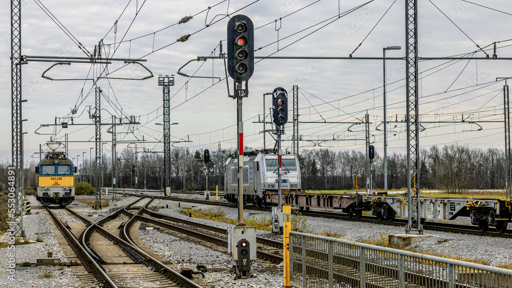 Traffic light shows red signal on railway. Train junction displaying ...