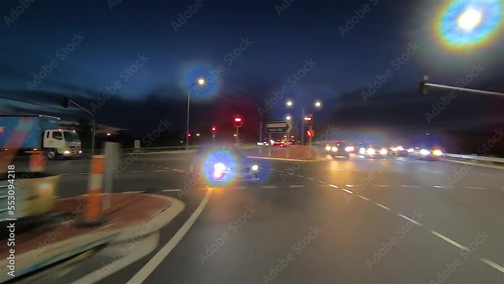 Rear facing night driving point of view POV for interior car scene ...