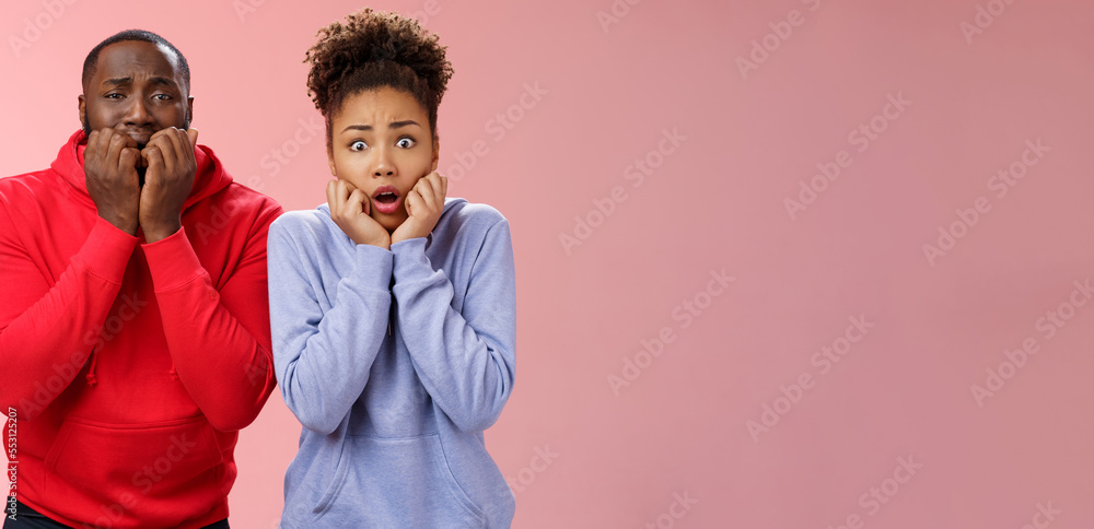 Shocked scared two insecure young african american couple both ...