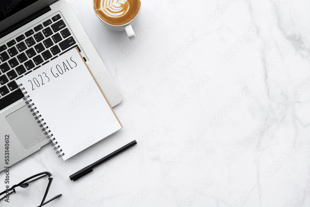 Notebook with 2023 goals text on it to apply new year resolutions and ...