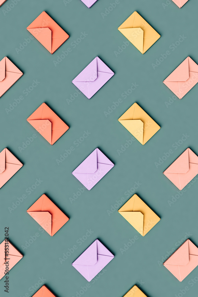 Three dimensional pattern of rows of pastel colored envelopes flat laid ...