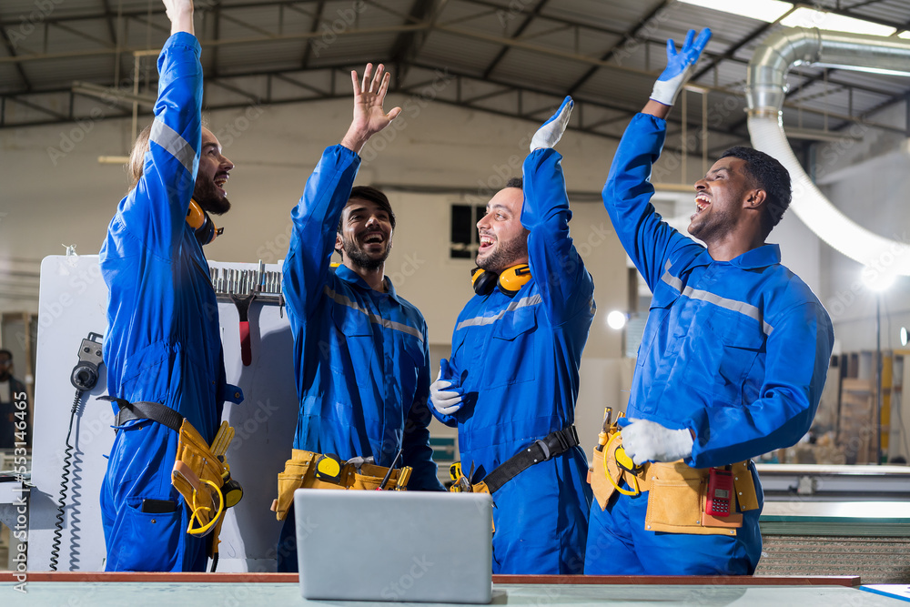 Group of male technician workers working and holding hands together in ...