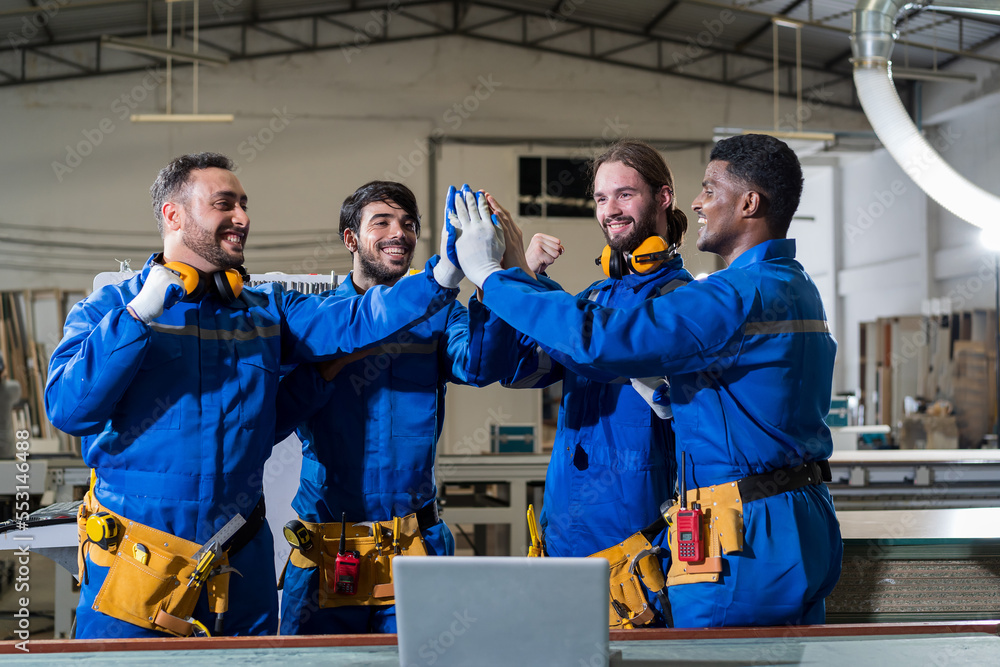 Group of male technician workers working and holding hands together in ...