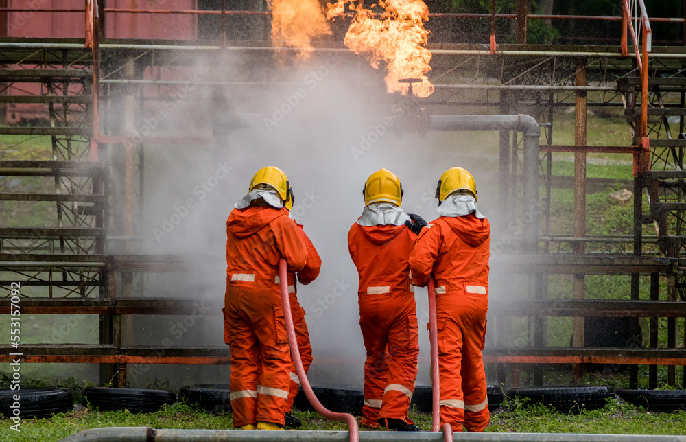 Firefighter Concept. Fireman using water and extinguisher to fighting ...