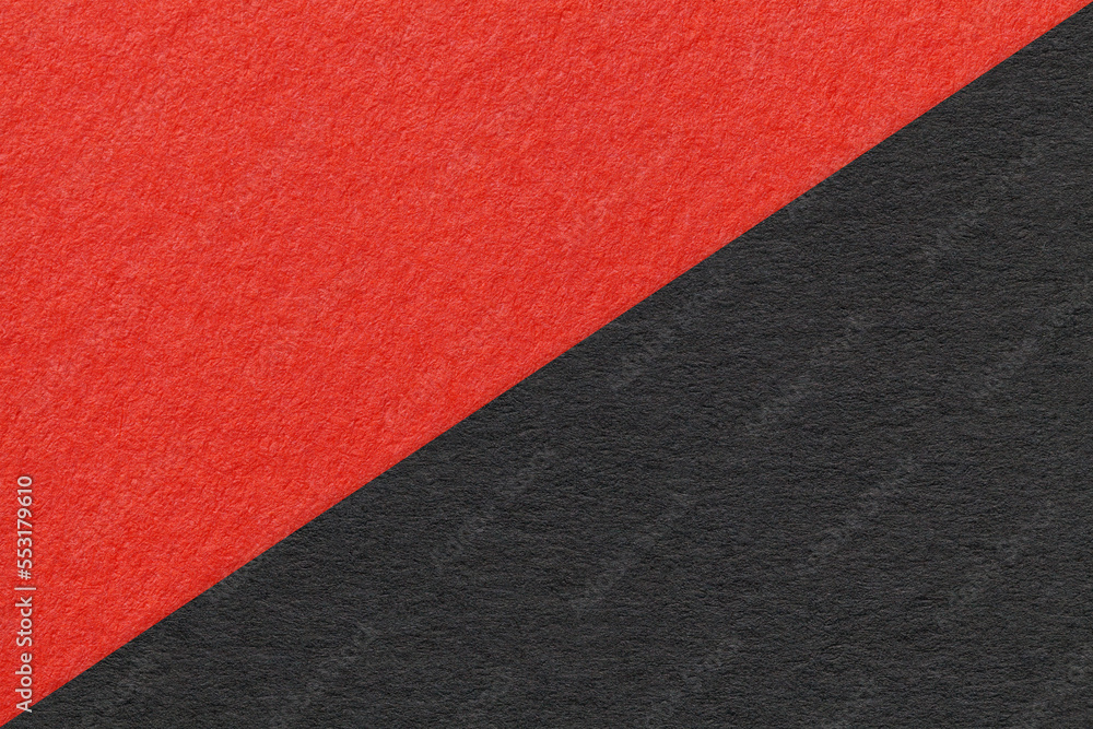 Texture of craft red and black paper background, half two colors, macro ...