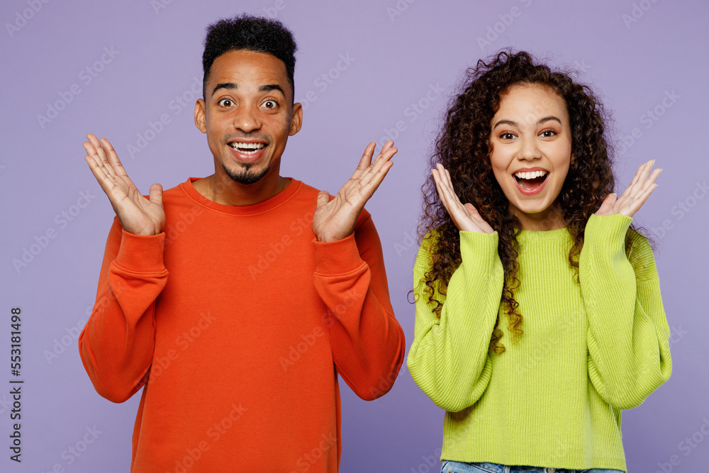 Young shocked amazed couple two friends family man woman of African ...