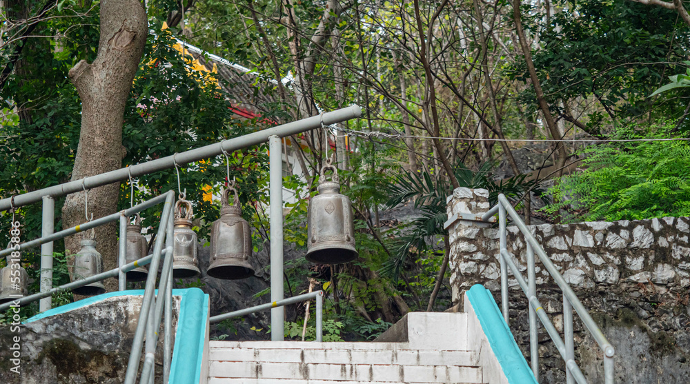 The bell is hung along the railing at the entrance to the temple. Stock ...