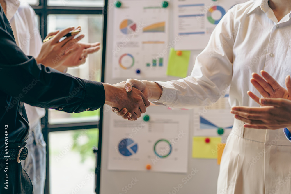 business people shaking hands with customers in a modern conference ...
