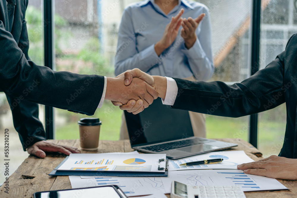 business people shaking hands with customers in a modern conference ...