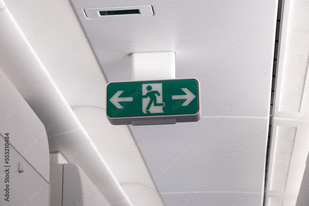 The emergency exit symbol show the escape way to leave the aircraft ...