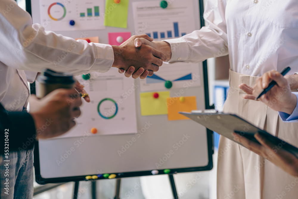 business people shaking hands with customers in a modern conference ...