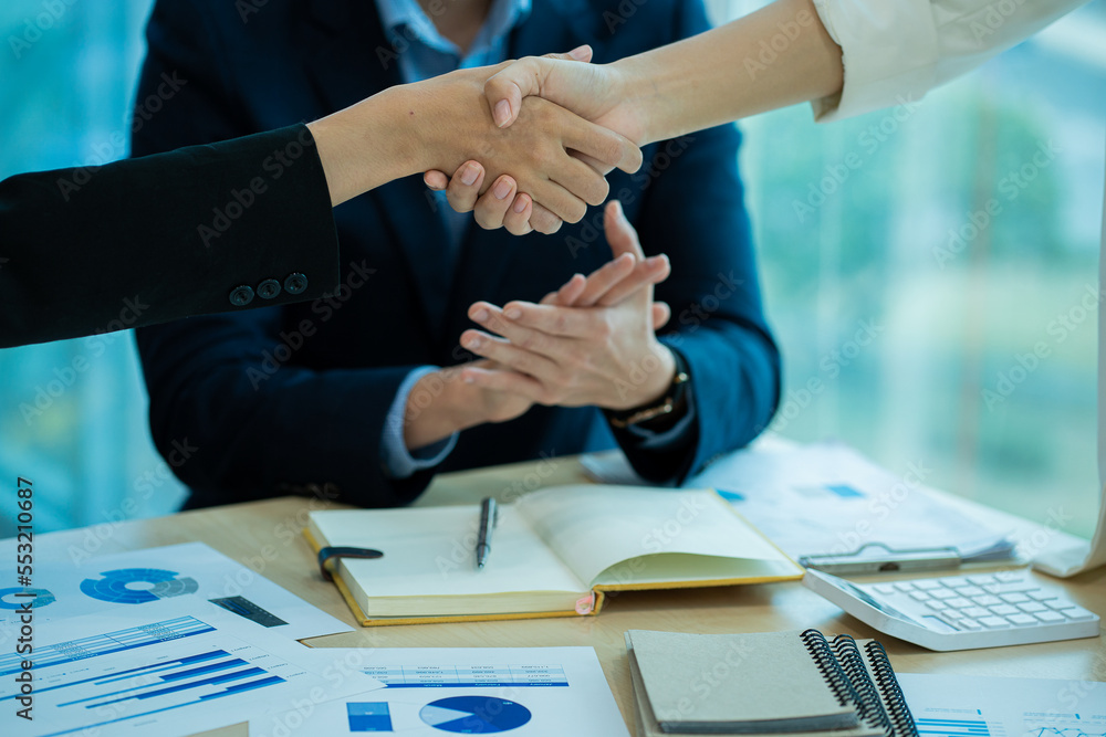 business people shaking hands with customers in a modern conference ...