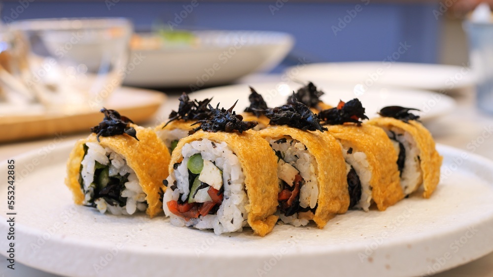 Appetizing Japanese rolls are taken with chopsticks and eaten ...