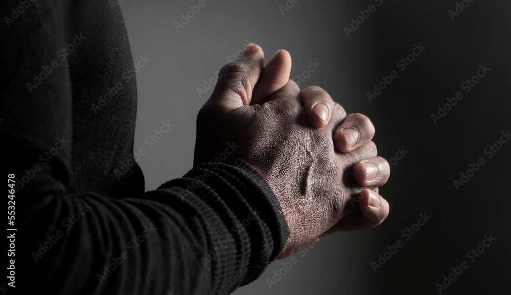 man praying to god with hands together Caribbean man praying with black ...